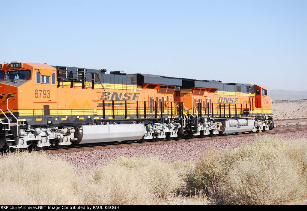 BNSF 6793 and BNSF 6794 pass me by as they roll into the yard.